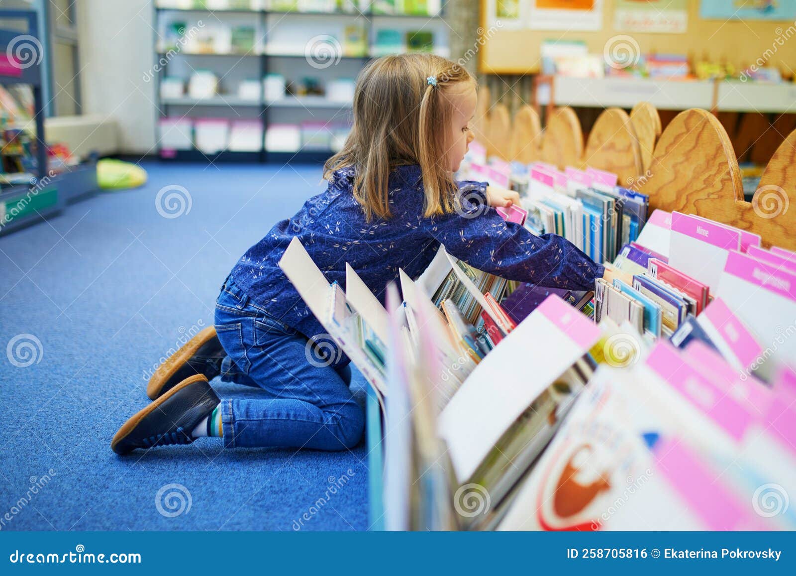 4 Year Old Girl Selecting a Book in Municipal Library Stock Photo ... 4 Year Old Girl Selecting a Book in Municipal Library Stock Photo ...