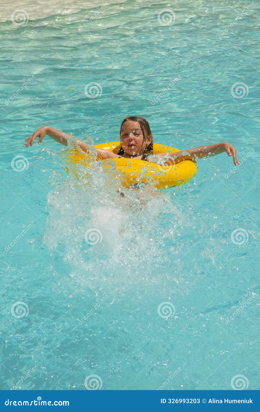 A 5-year-old Girl Swims in a Pool with an Inflatable Circle Stock Image ...