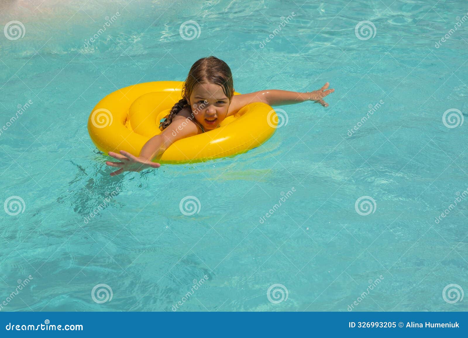 A 5-year-old Girl Swims in a Pool with an Inflatable Circle Stock Image ...