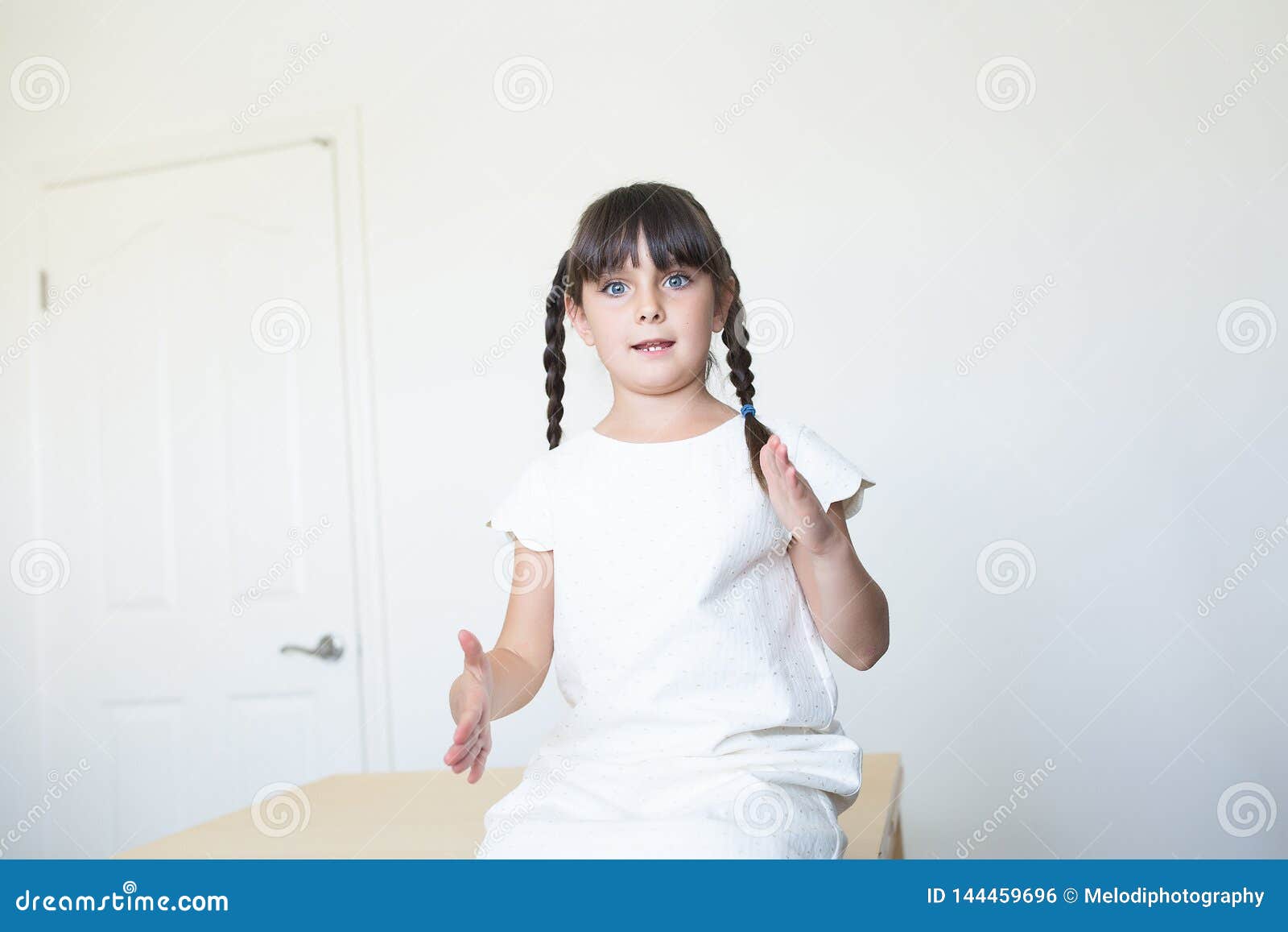 Child Communicating with Hands Stock Photo - Image of casual, blue ...