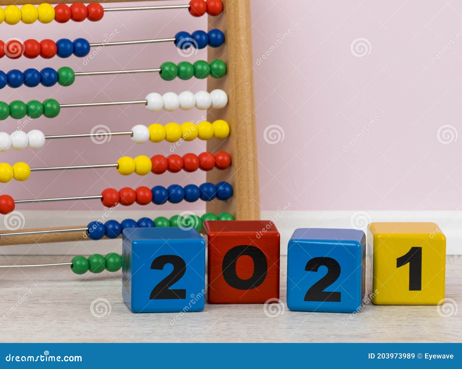 Year 2021 Written with Alphabet Building Blocks, Abacus in Background ...