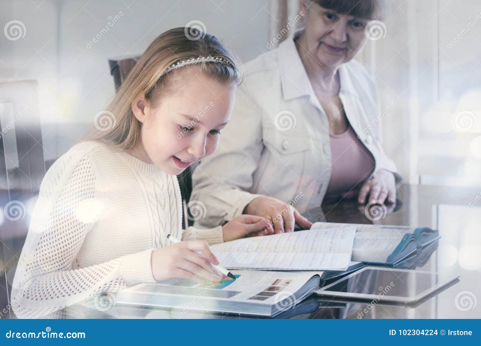 10 Years Old Girl and Her Teacher. Little Girl Study during Her Private ...