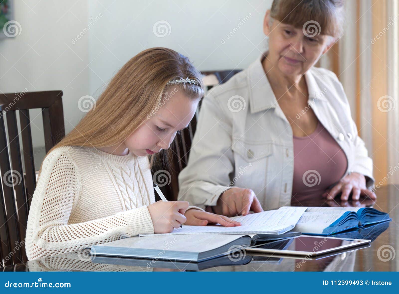10 Years Old Girl and Her Teacher. Little Girl Study during Her Private ...