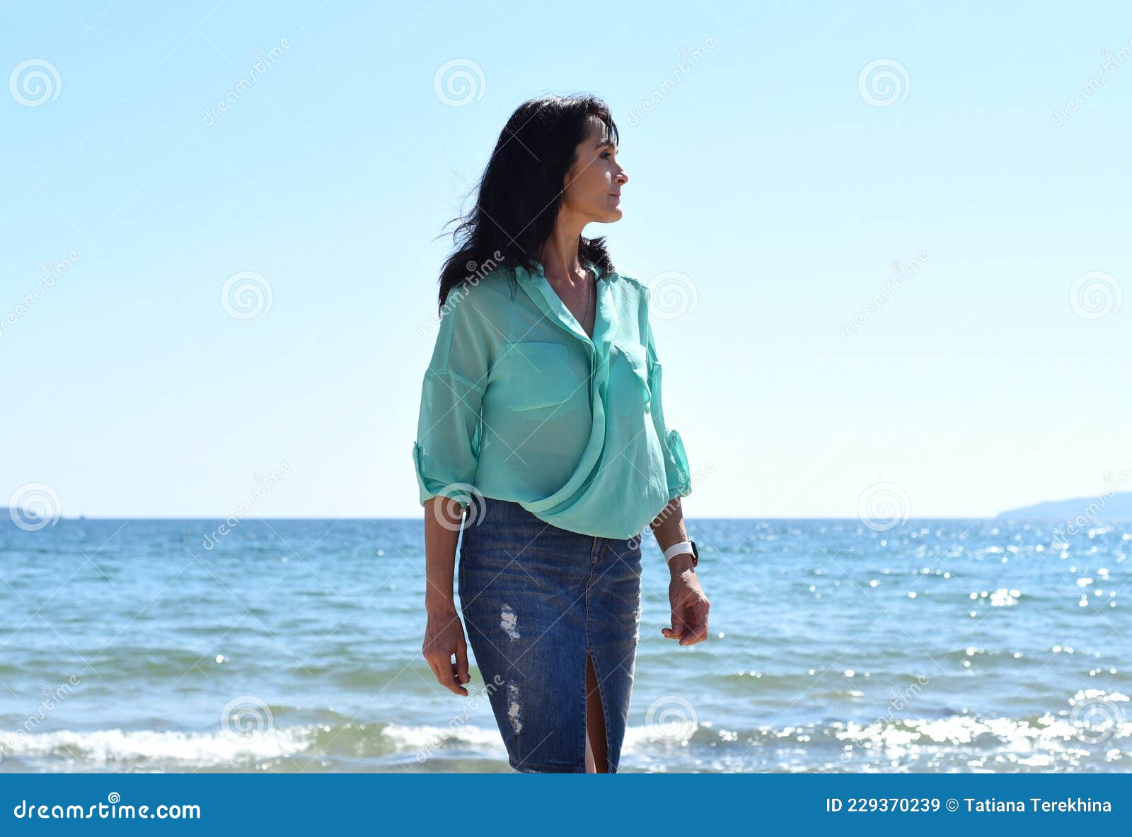 45 Years Old Russian Woman Standing In Japanese Sea And Looking Away