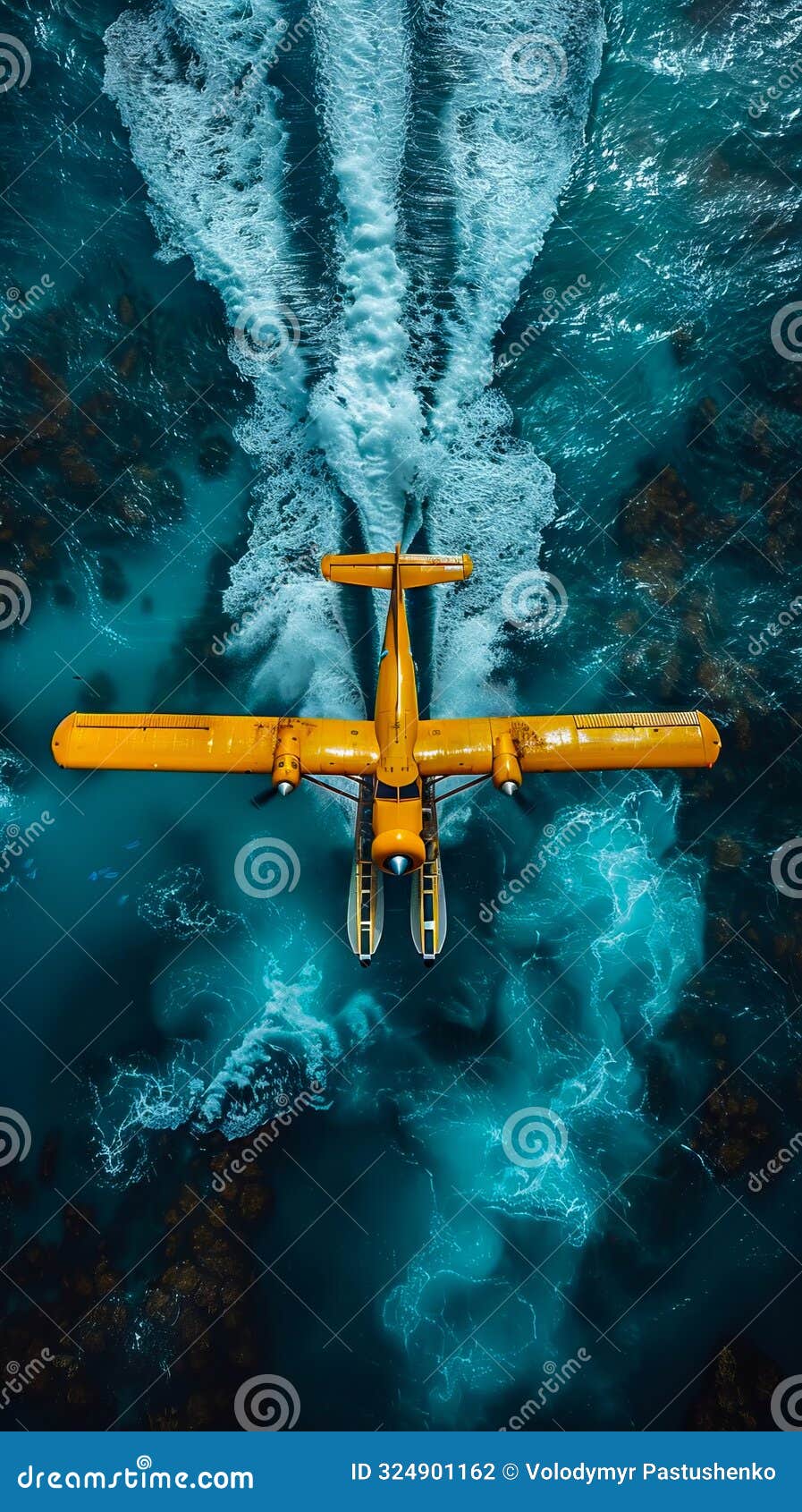 A Yellow Airplane Flying Over the Ocean Stock Photo - Image of biplane ...