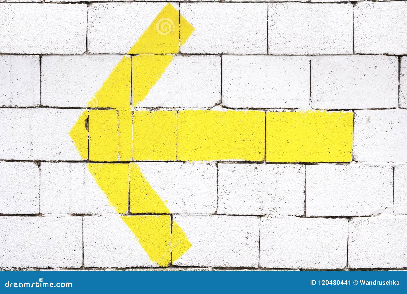 A Yellow Arrow on a Brick Wall Stock Image - Image of brick, industry ...