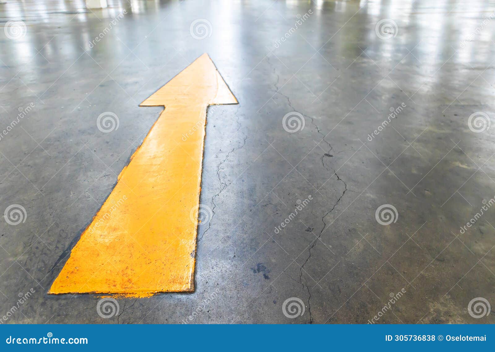 Yellow Arrow on Concrete Road in Building Stock Photo - Image of ...