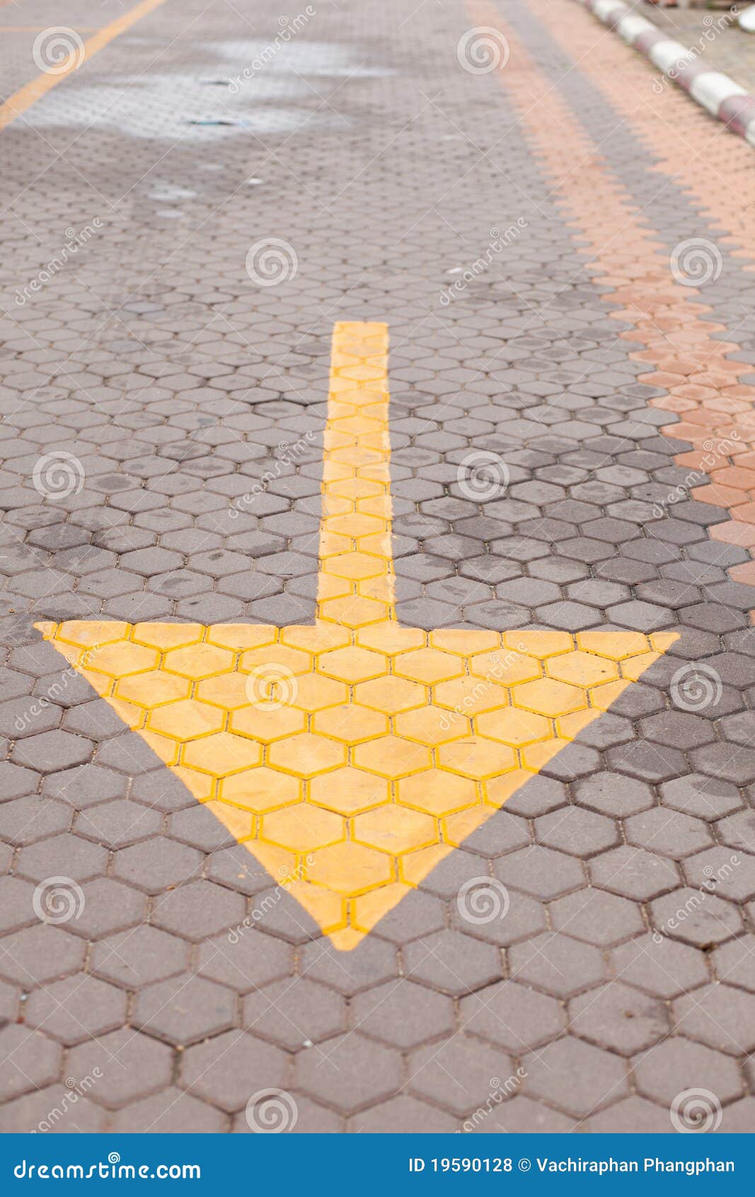 Yellow arrow on the ground stock photo. Image of city - 19590128