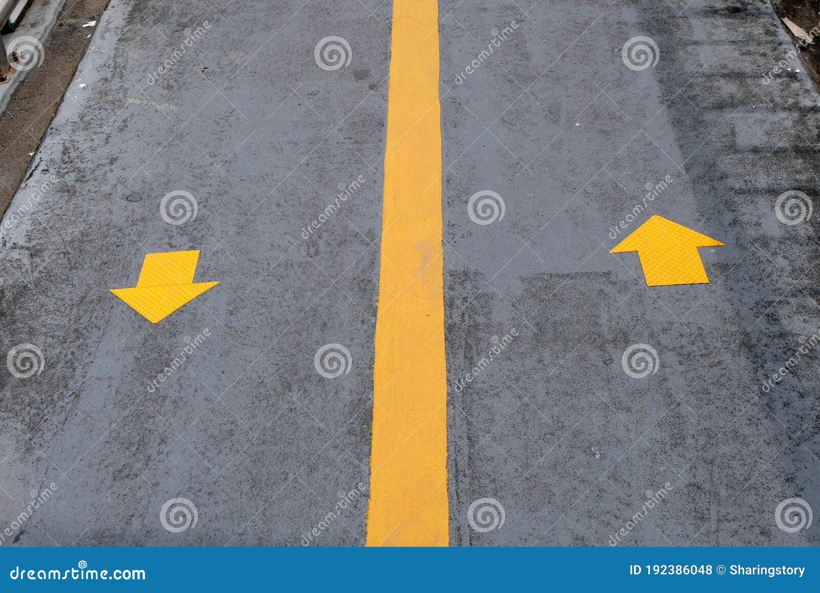 Yellow Arrow Painted in a Pathway. Directional Sign Stock Photo - Image ...