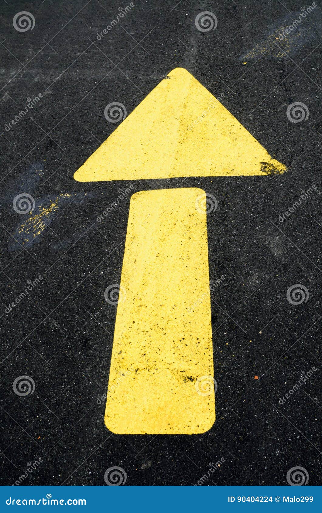 Yellow arrow on pavement stock photo. Image of traffic - 90404224
