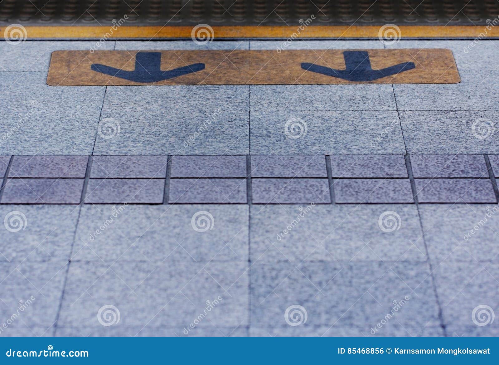 Yellow Arrow Sign on Floor at Train Platform, Subway Station Stock ...