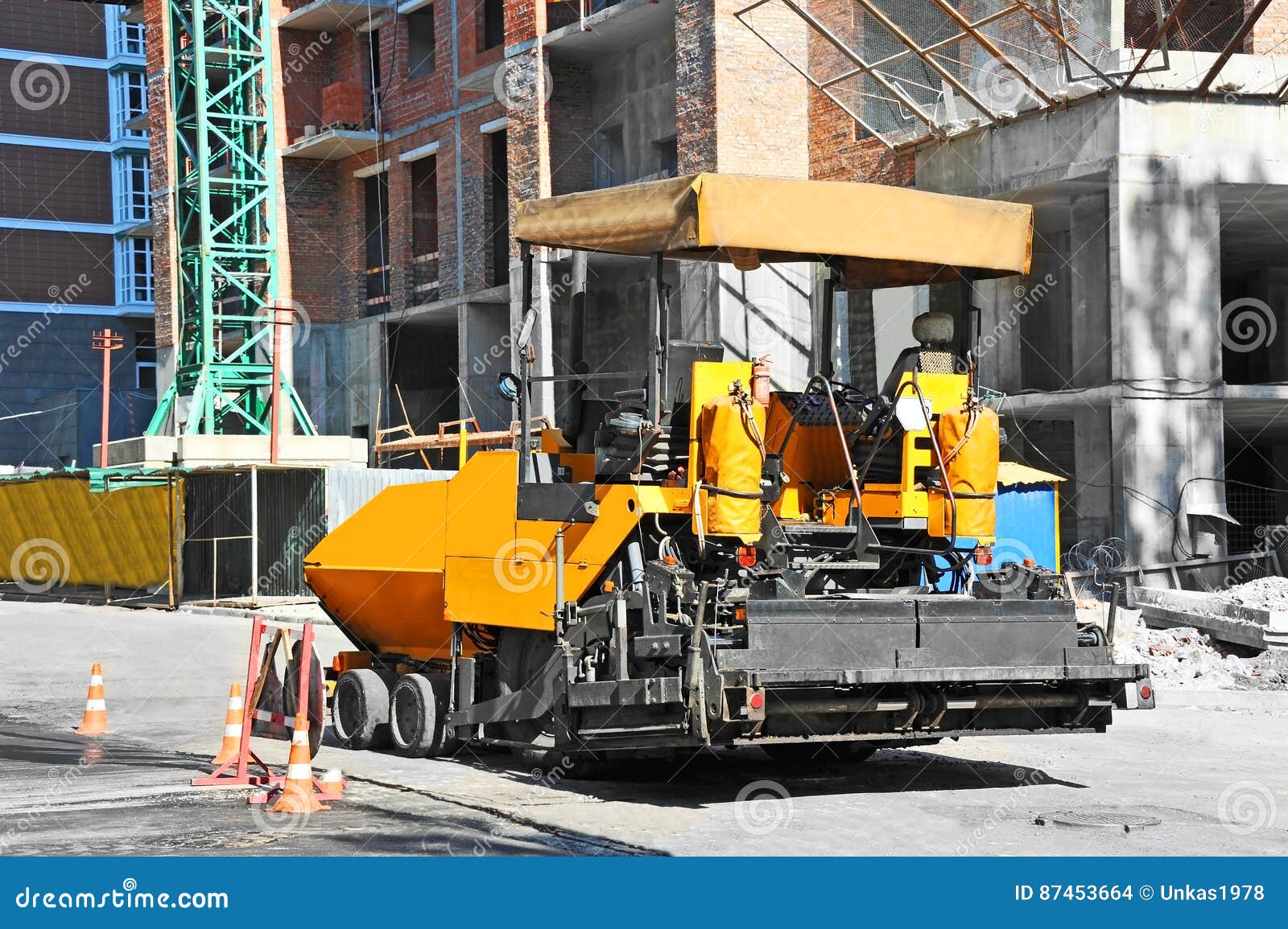 Yellow asphalt machine stock photo. Image of paving, build - 87453664