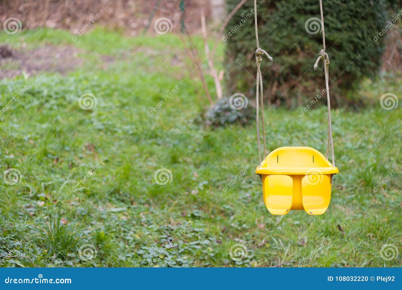 Yellow Baby Swing Hanging on a Tree Stock Photo - Image of calm ...