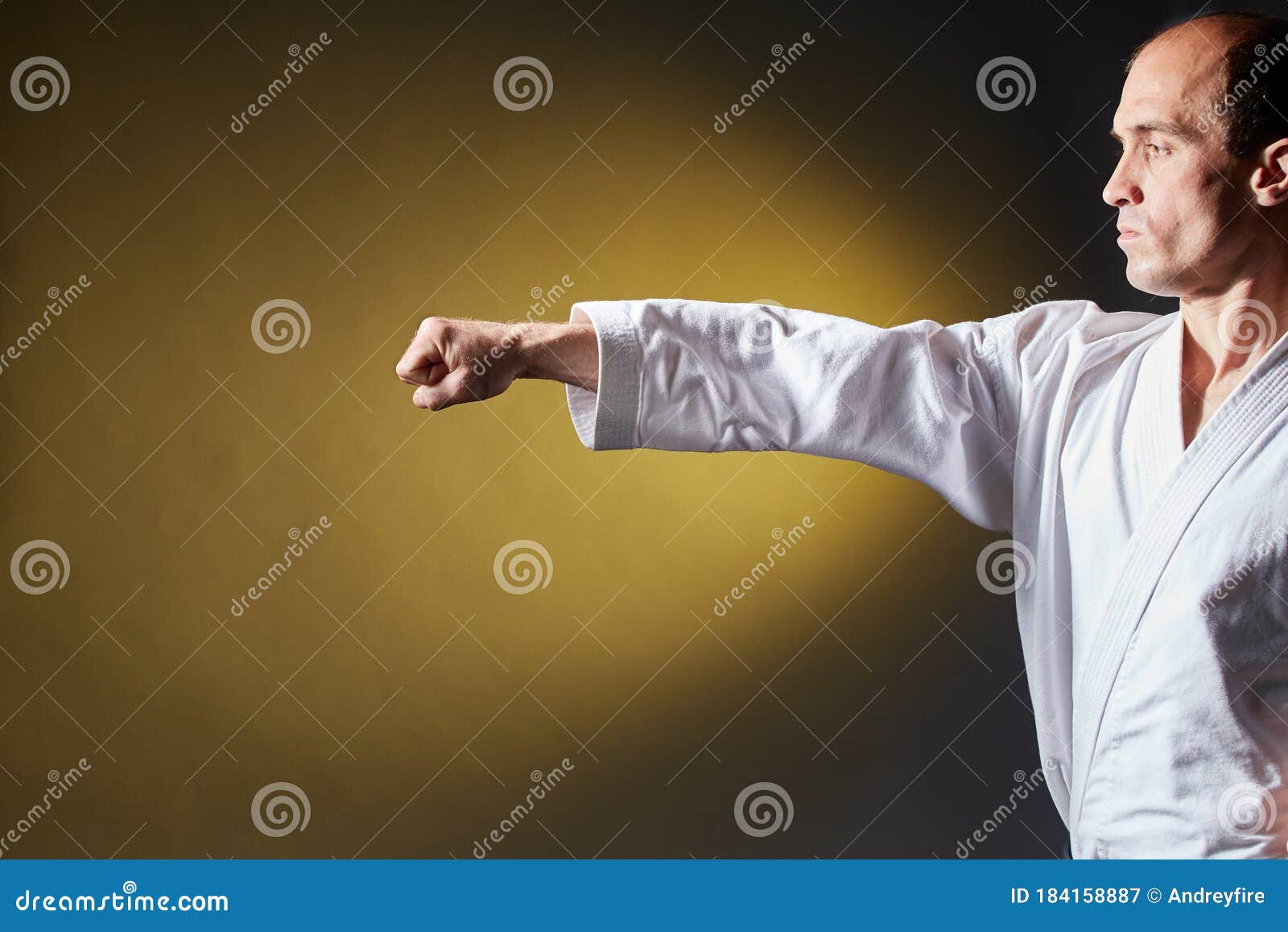 On a Yellow Background, a Young Athlete Beats a Punch Arm Stock Image ...