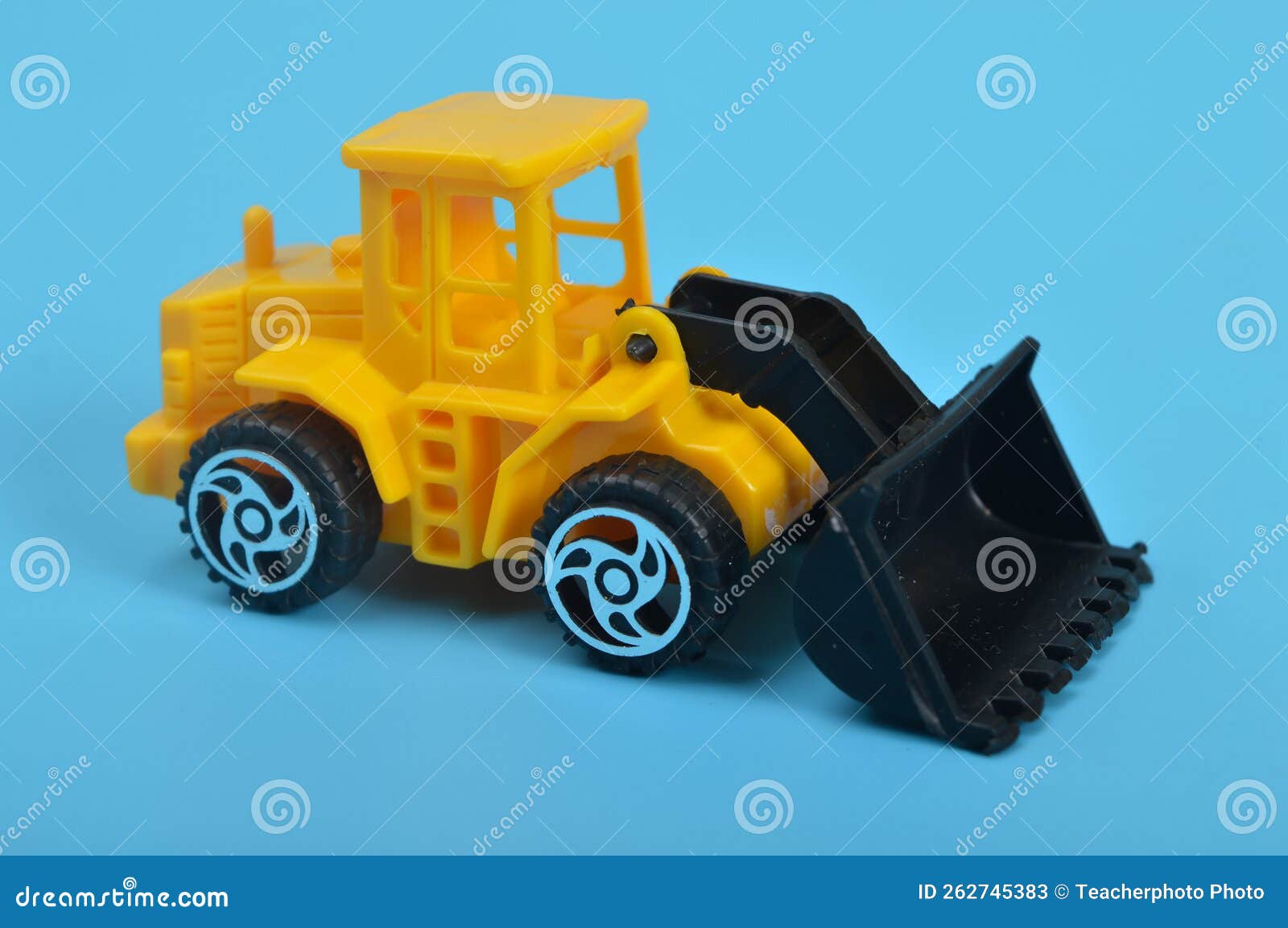 Yellow Backhoe Loader Isolated on a Blue Background Stock Image - Image ... Yellow Backhoe Loader Isolated on a Blue Background Stock Image - Image ...