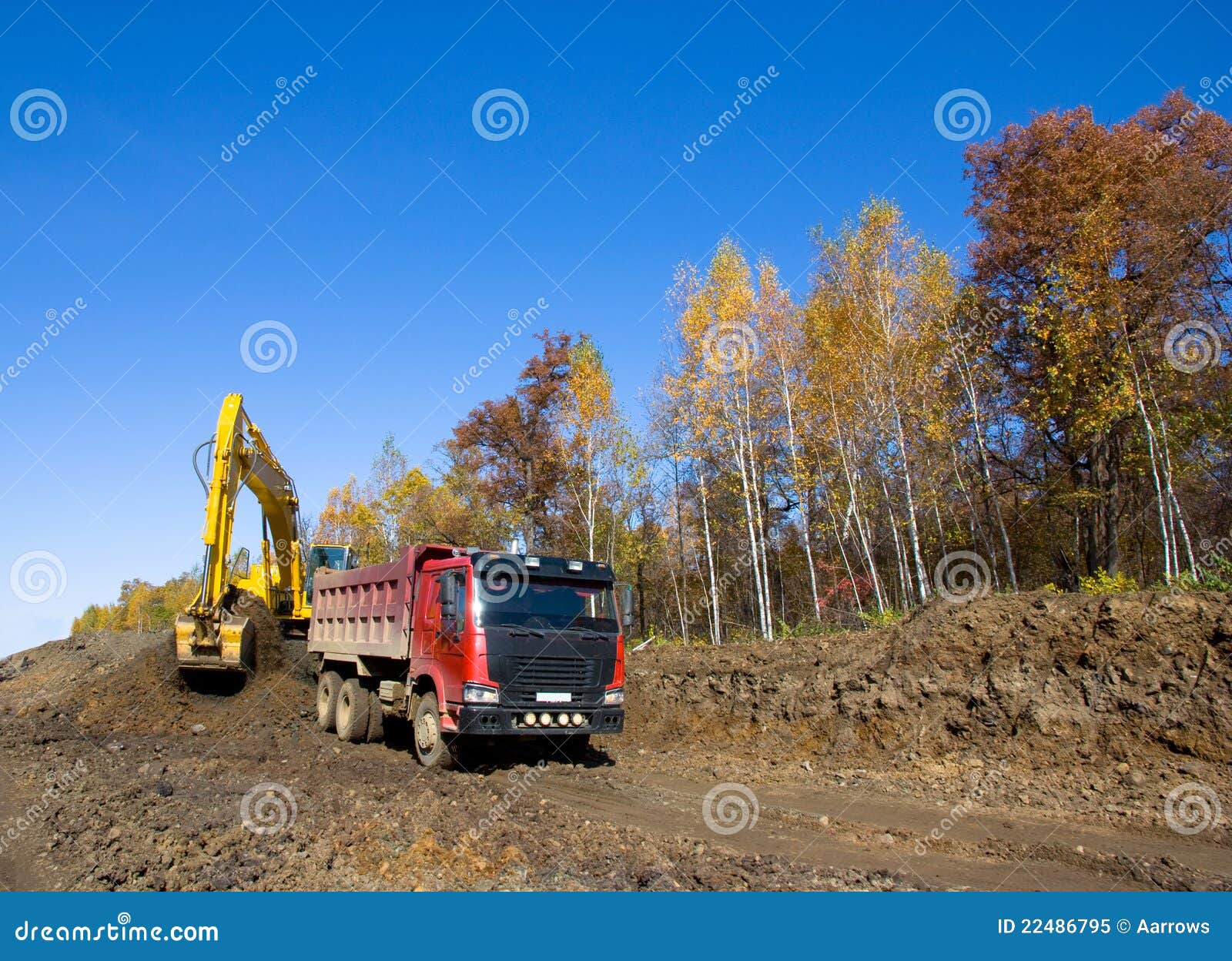 Yellow backhoe and truck. stock image. Image of loading - 22486795
