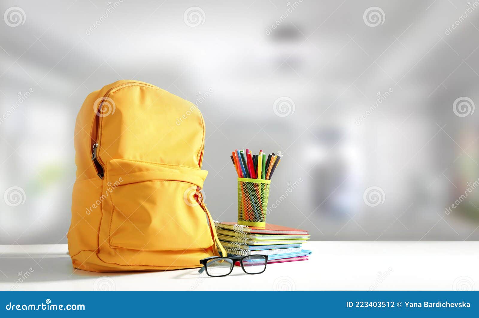 Yellow Backpack on Table Empty Copy Space. School Supplies Stock Photo ...