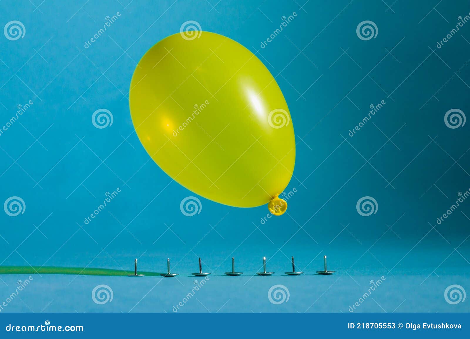 Yellow Balloon Drops Sharp Buttons. the Ball Will Burst from Piercing ...