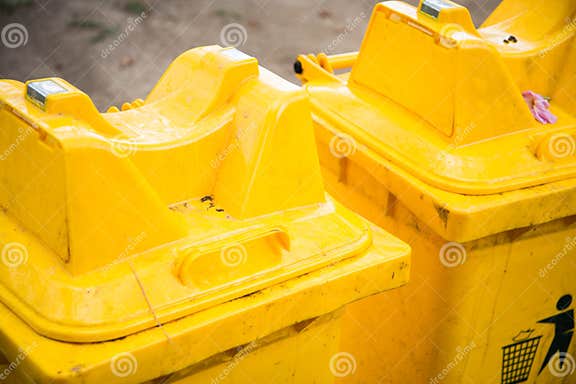 Yellow bins stock photo. Image of awareness, plastic - 37935744