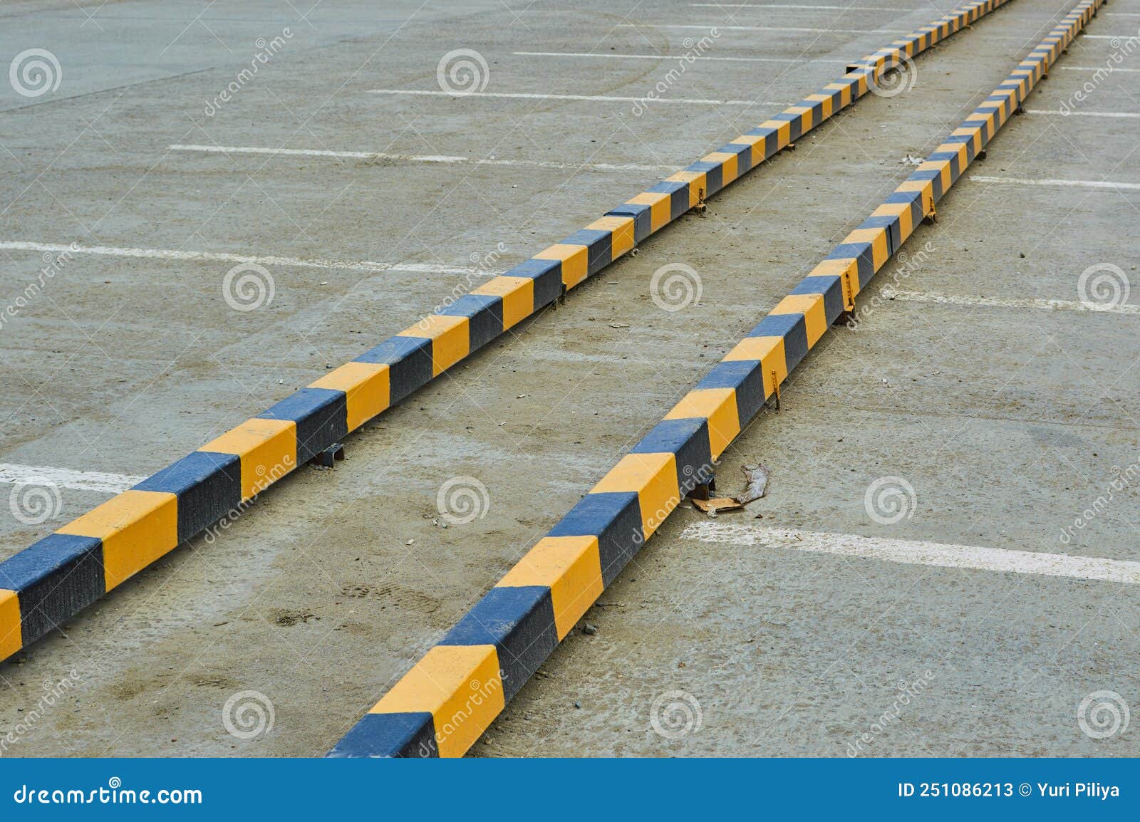 Yellow-black Protective Beam in the Parking Lot Stock Image - Image of ...