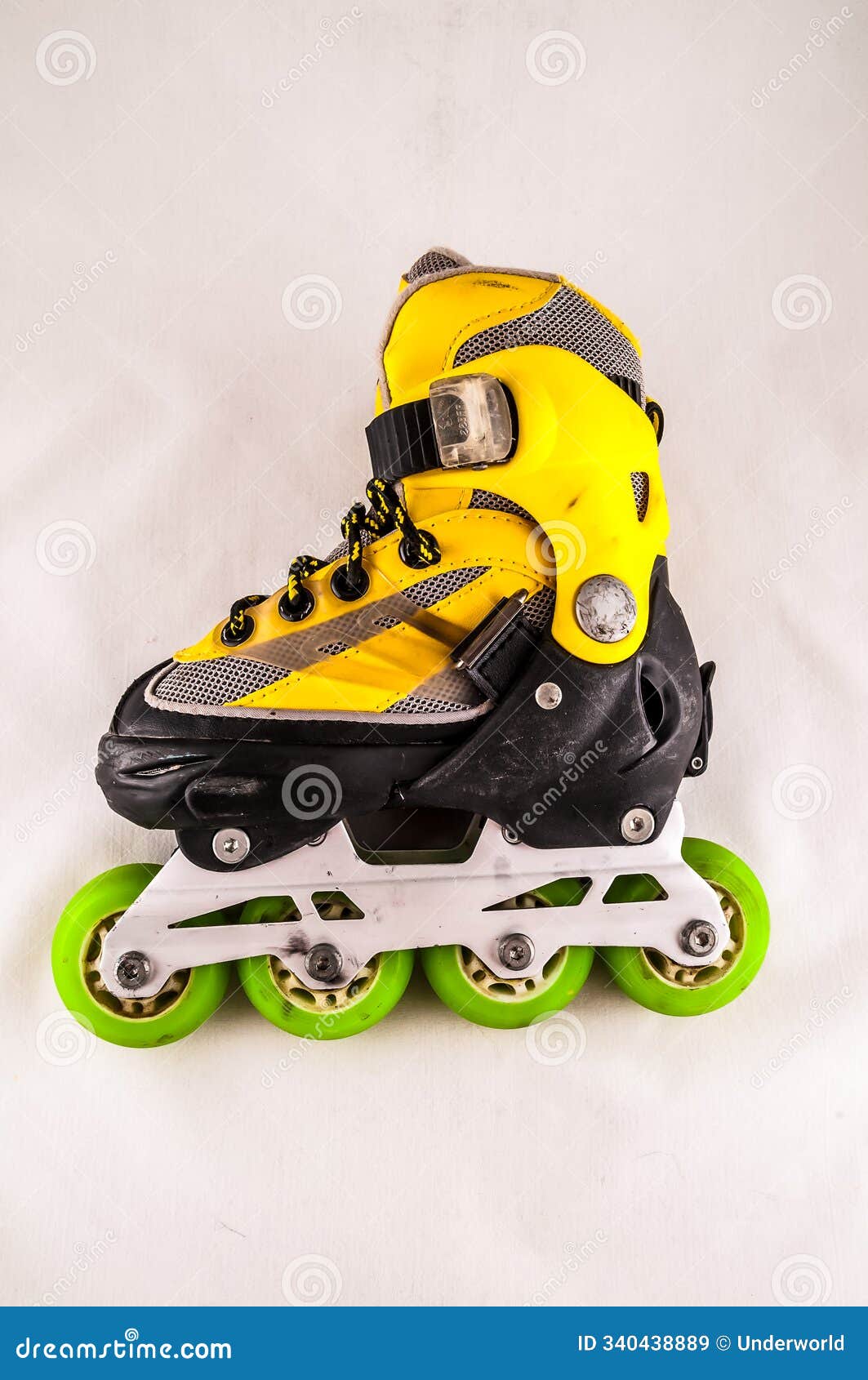 A Yellow and Black Roller Skate with Green Wheels Stock Image - Image ...