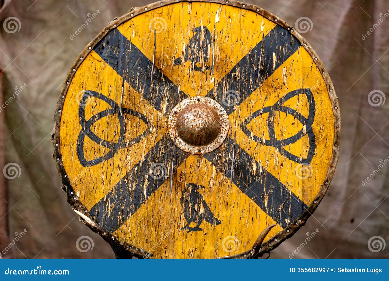Black Shield Emblem With Rope Border On Dark Fabric Background Royalty ...