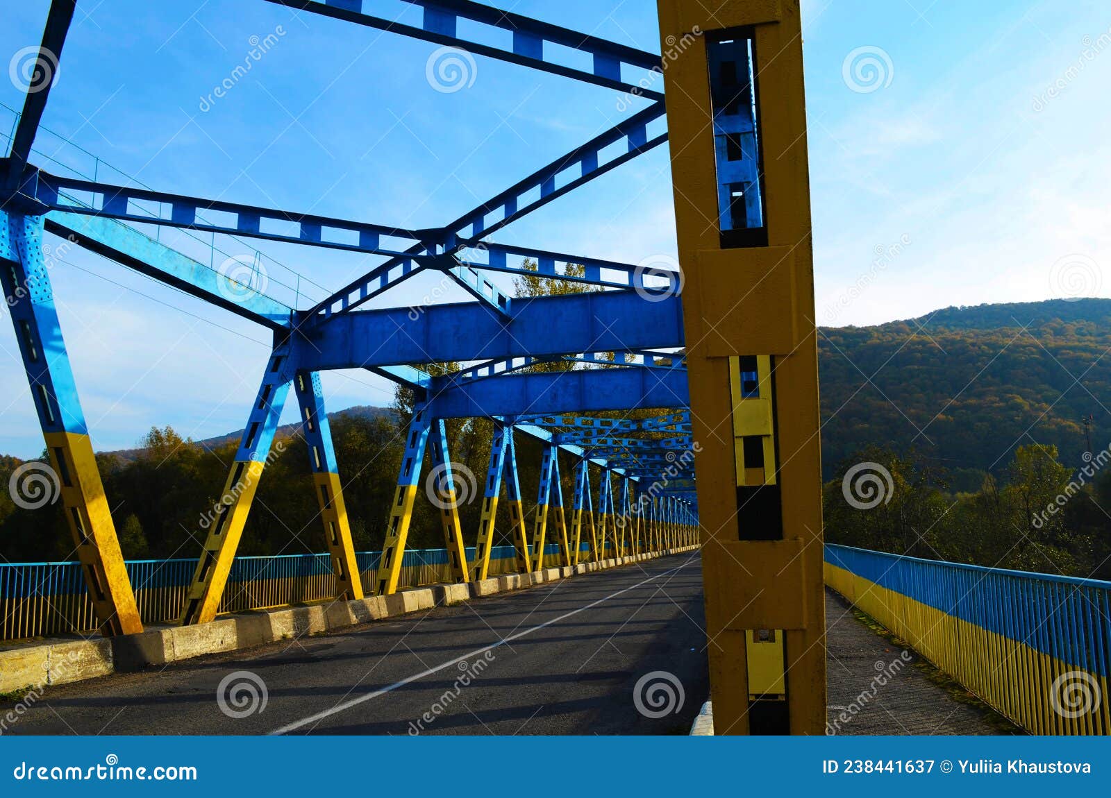 Yellow and Blue Bridge with Clear Blue Sky Stock Image - Image of ...