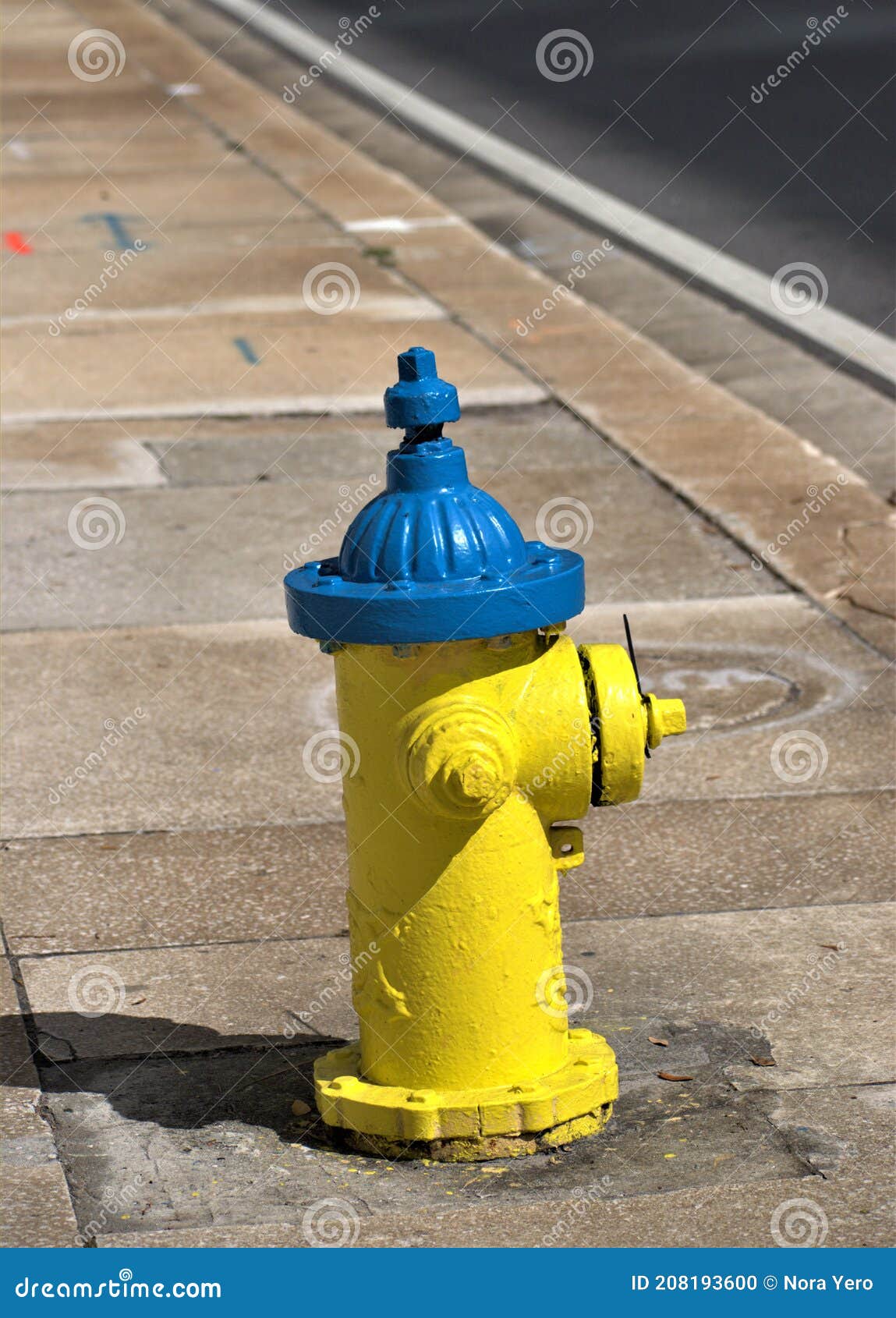 Yellow and Blue Fire Hydrant Stock Photo - Image of extinguisher ...