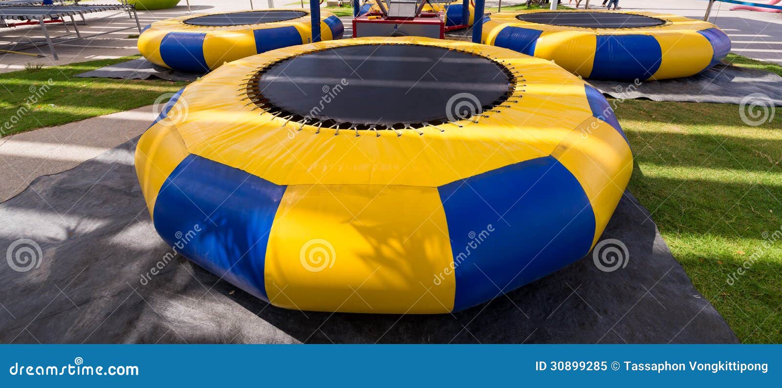 Yellow Blue Strip Trampoline Set in the Park Stock Image - Image of ...