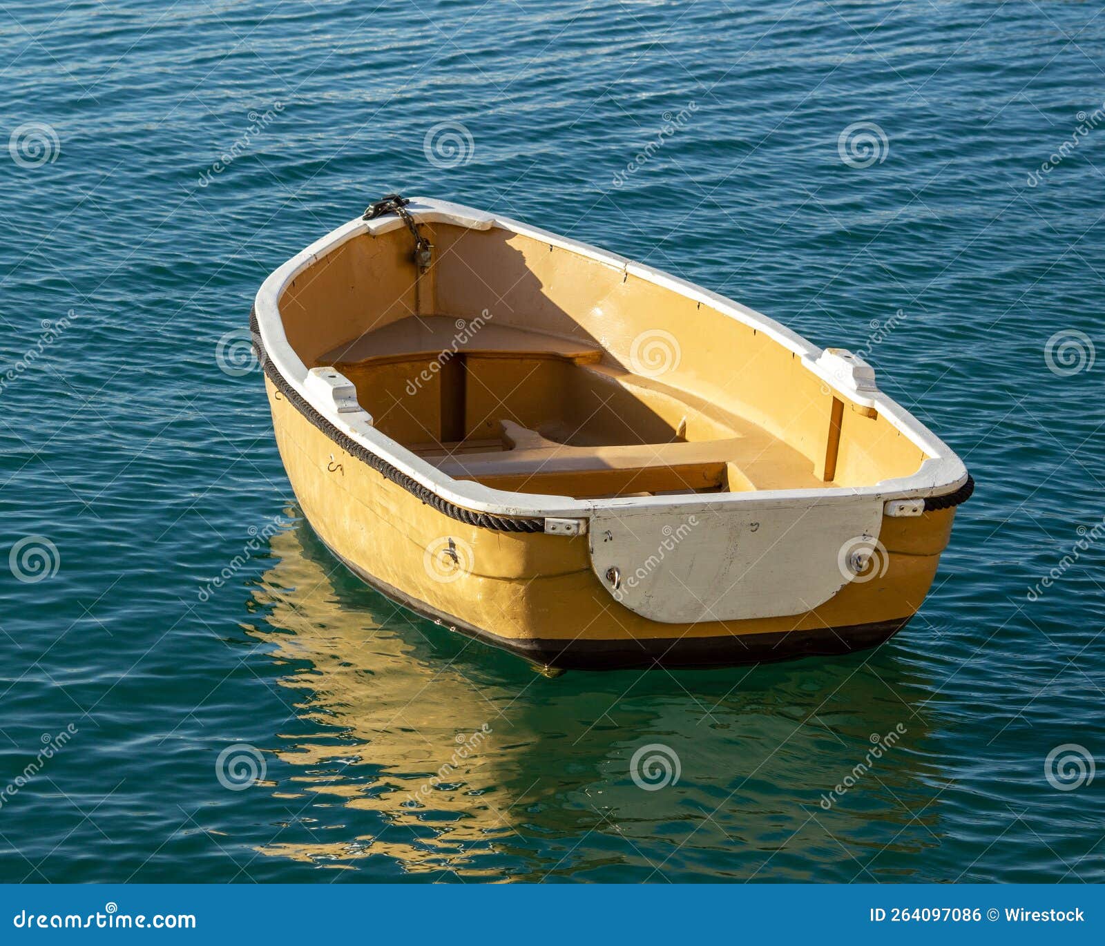 Yellow boat on the water stock photo. Image of water - 264097086