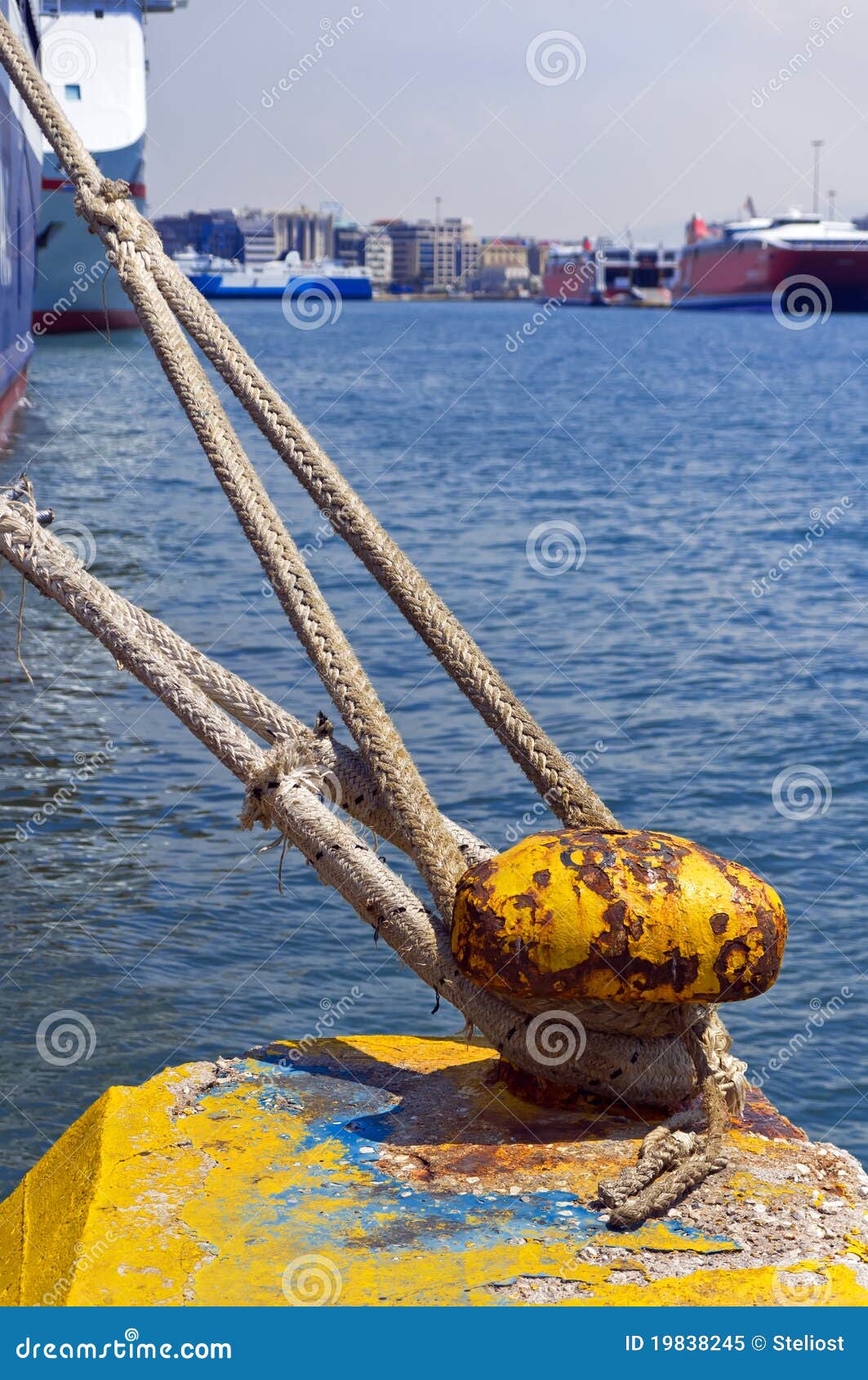 Yellow bollard stock image. Image of security, blue, nautical - 19838245