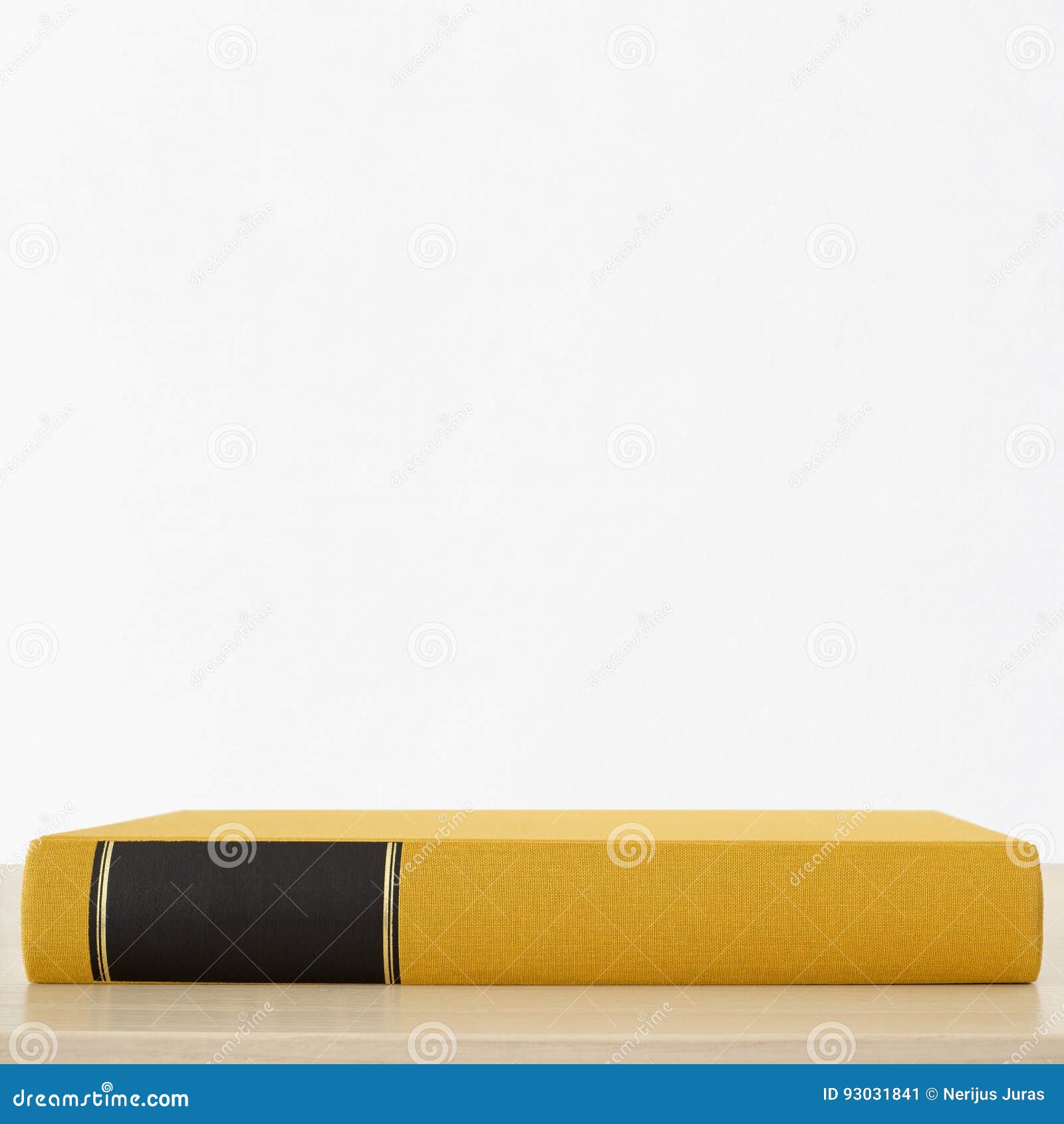 Yellow Book with Black Frame on Spine on the Table Stock Image - Image ...