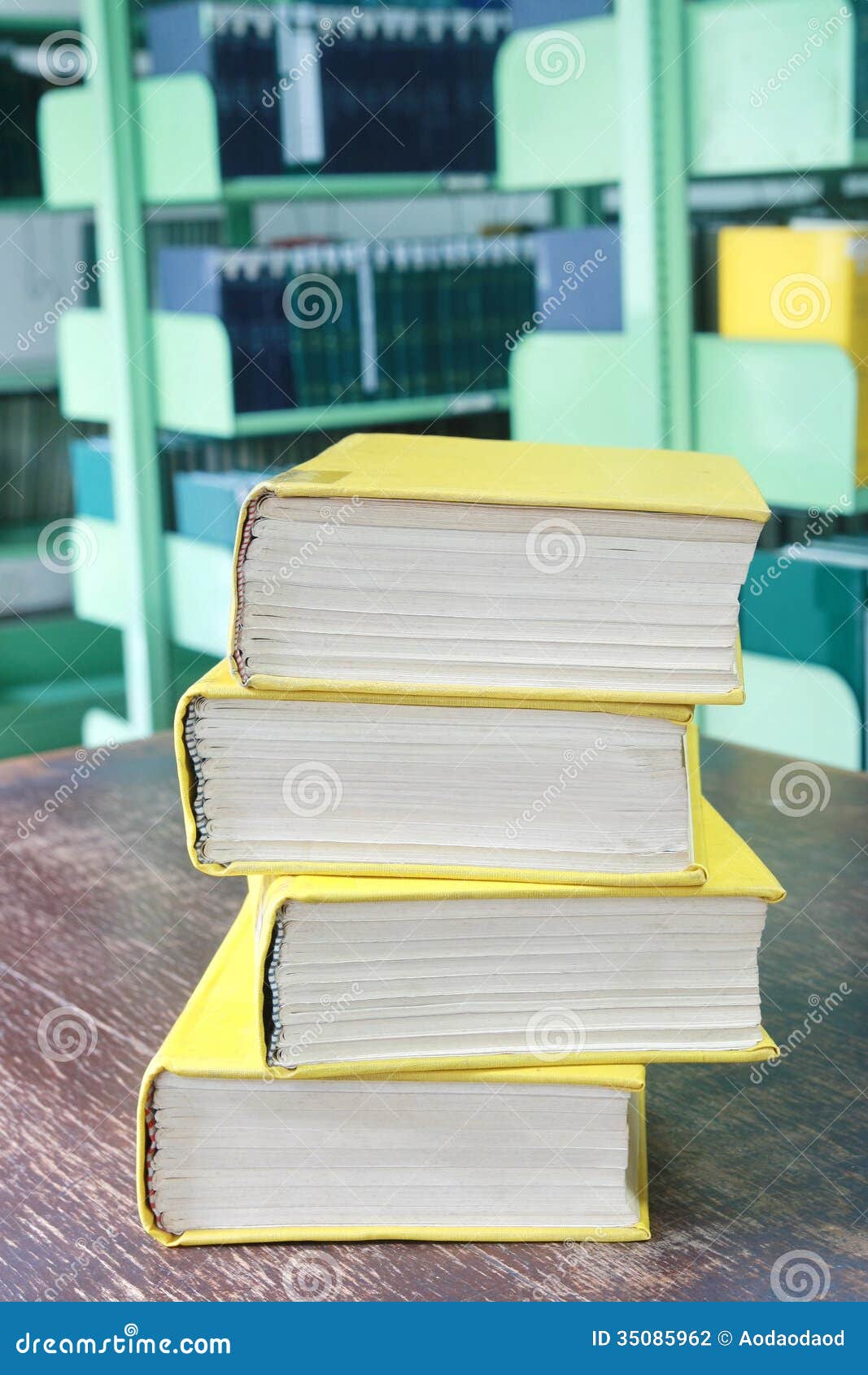 Yellow book stack on table stock photo. Image of bible - 35085962