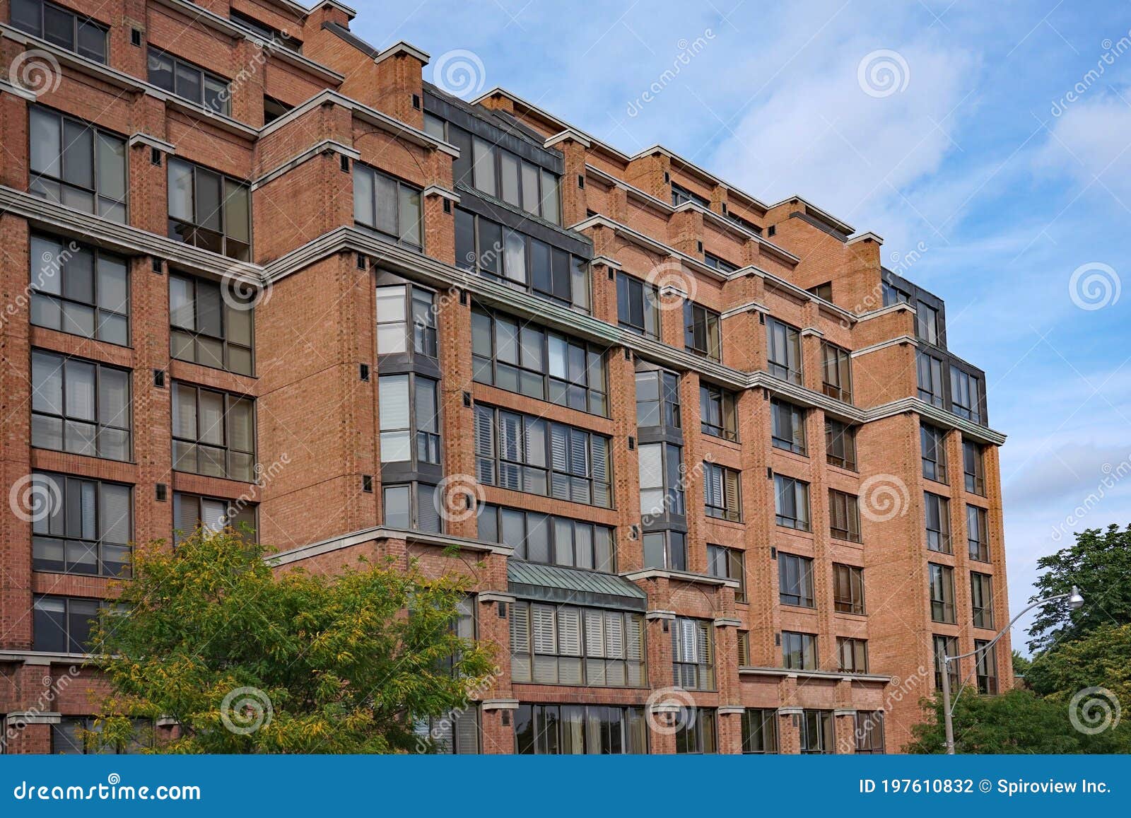 Yellow Brick Apartment Building Stock Photo - Image of apartment ...