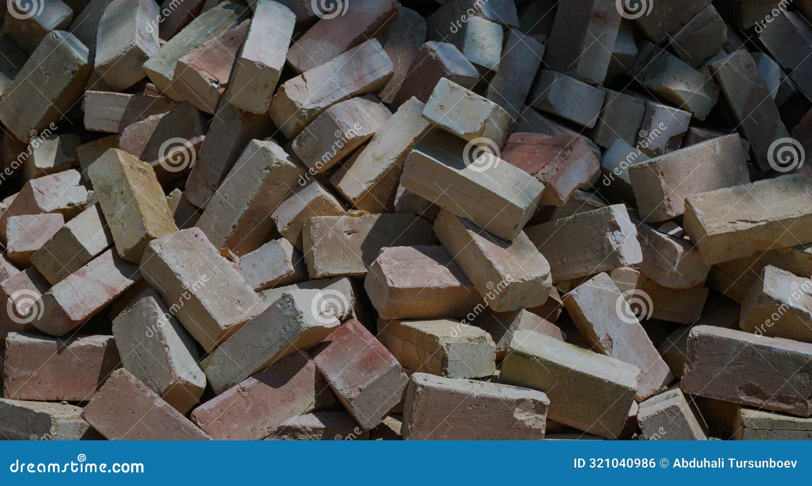 Yellow Brick Piled Up on the Ground Stock Photo - Image of industrial ...