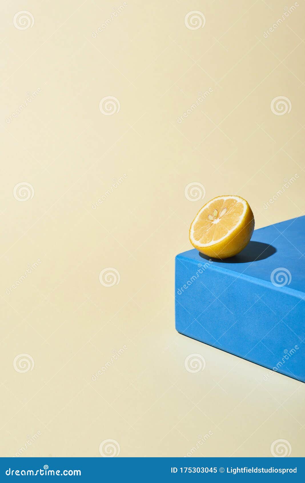 Yellow Bright Lemon Half on Blue Cube on Beige Background. Stock Image ...