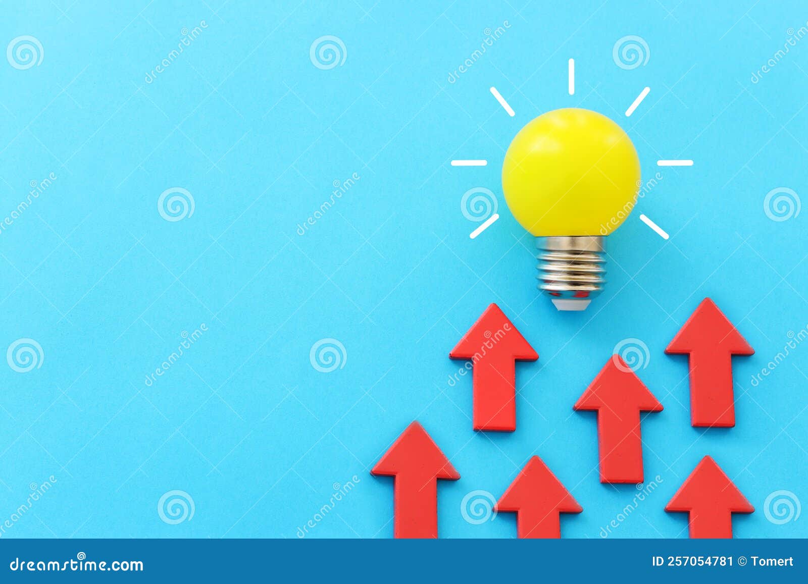 Yellow Bright Light Bulb and Arrow Sign Over Blue Background Stock ...