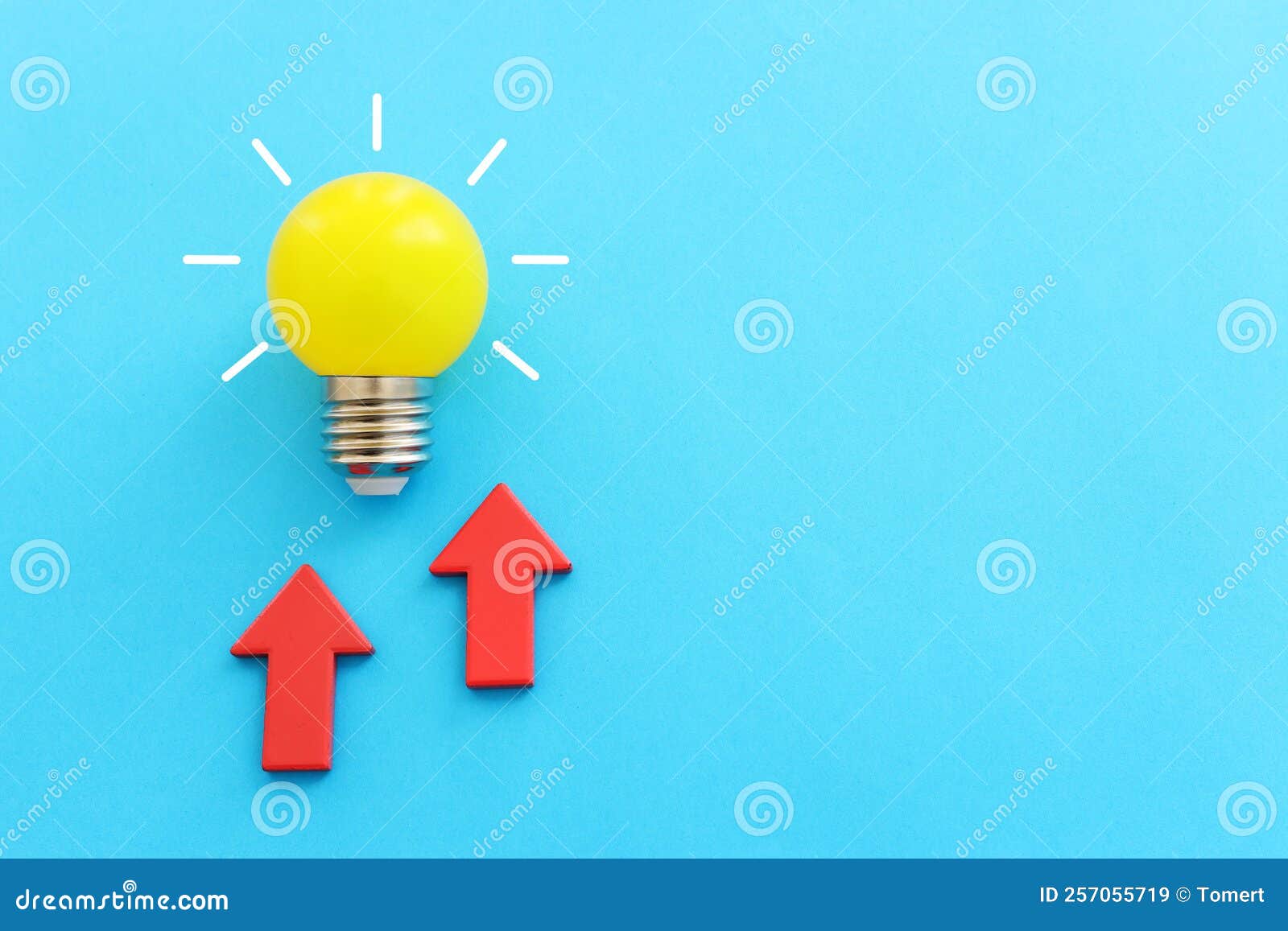 Yellow Bright Light Bulb and Arrow Sign Over Blue Background Stock ...