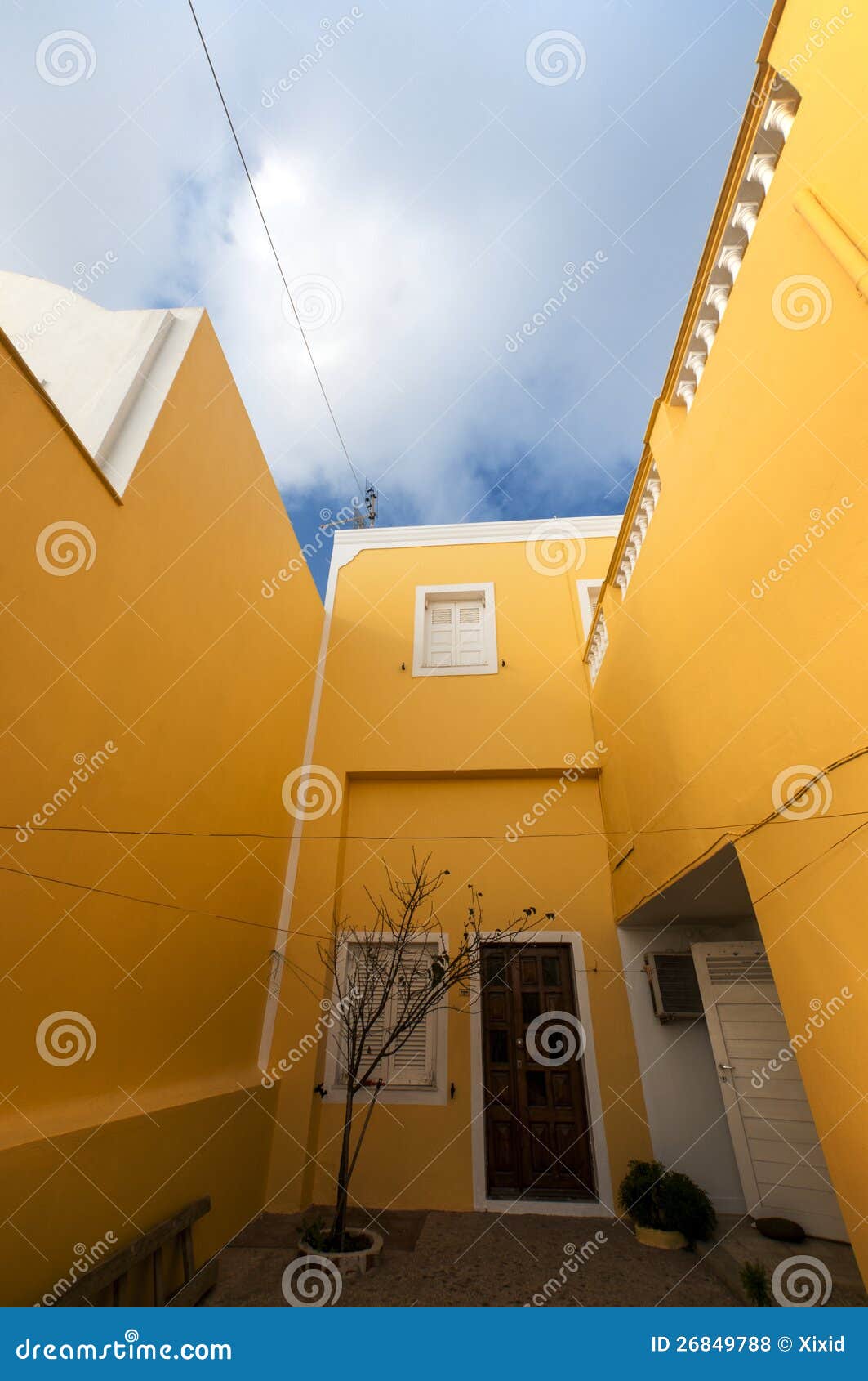 A yellow building stock photo. Image of construction - 26849788