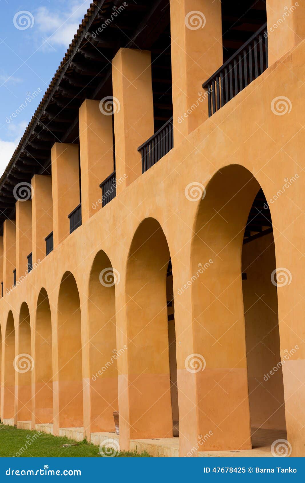 Yellow Building with Arches Stock Image - Image of building, arches ...
