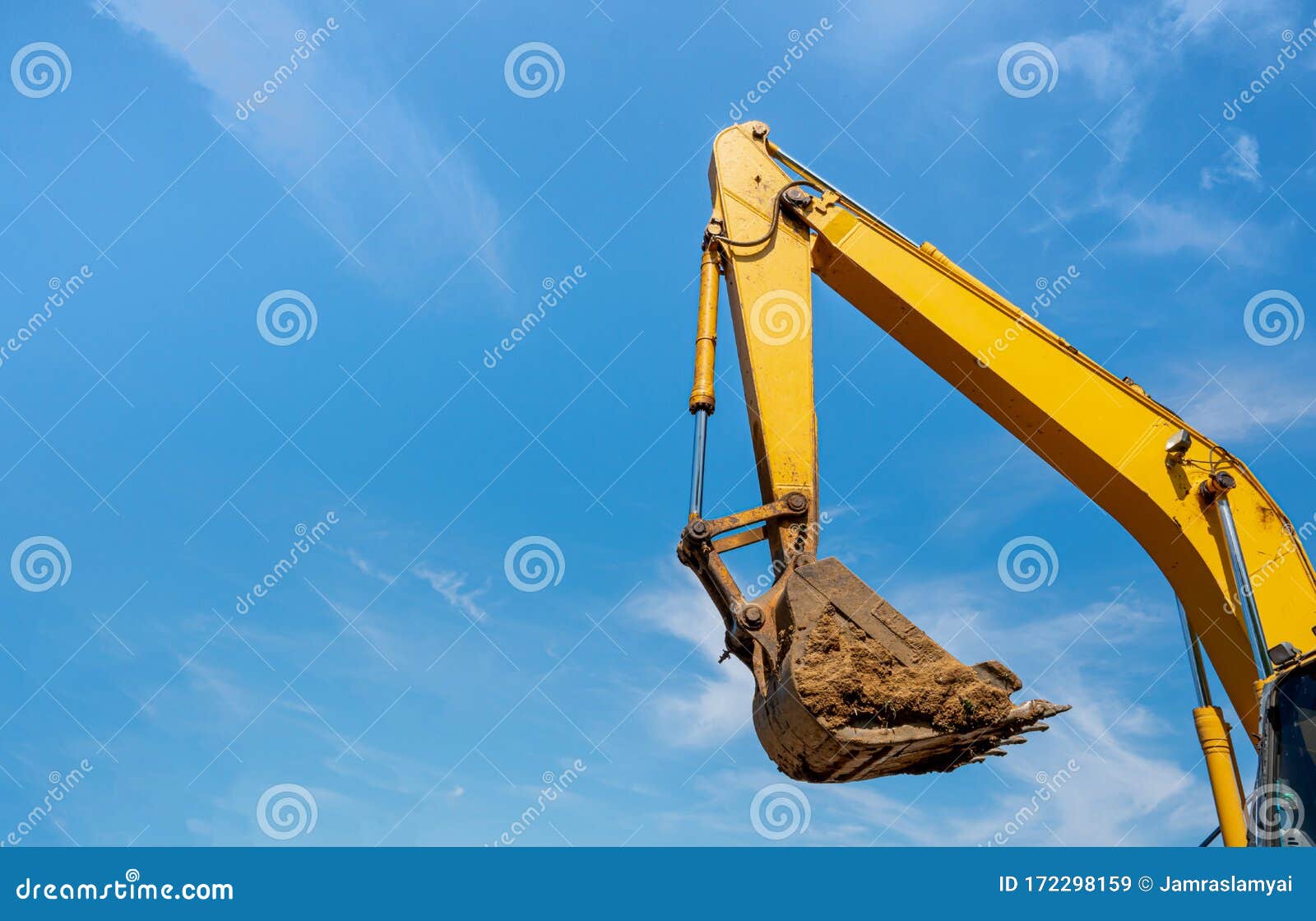 Backhoe Bucket Digging At Road Construction Site Stock Photography ...