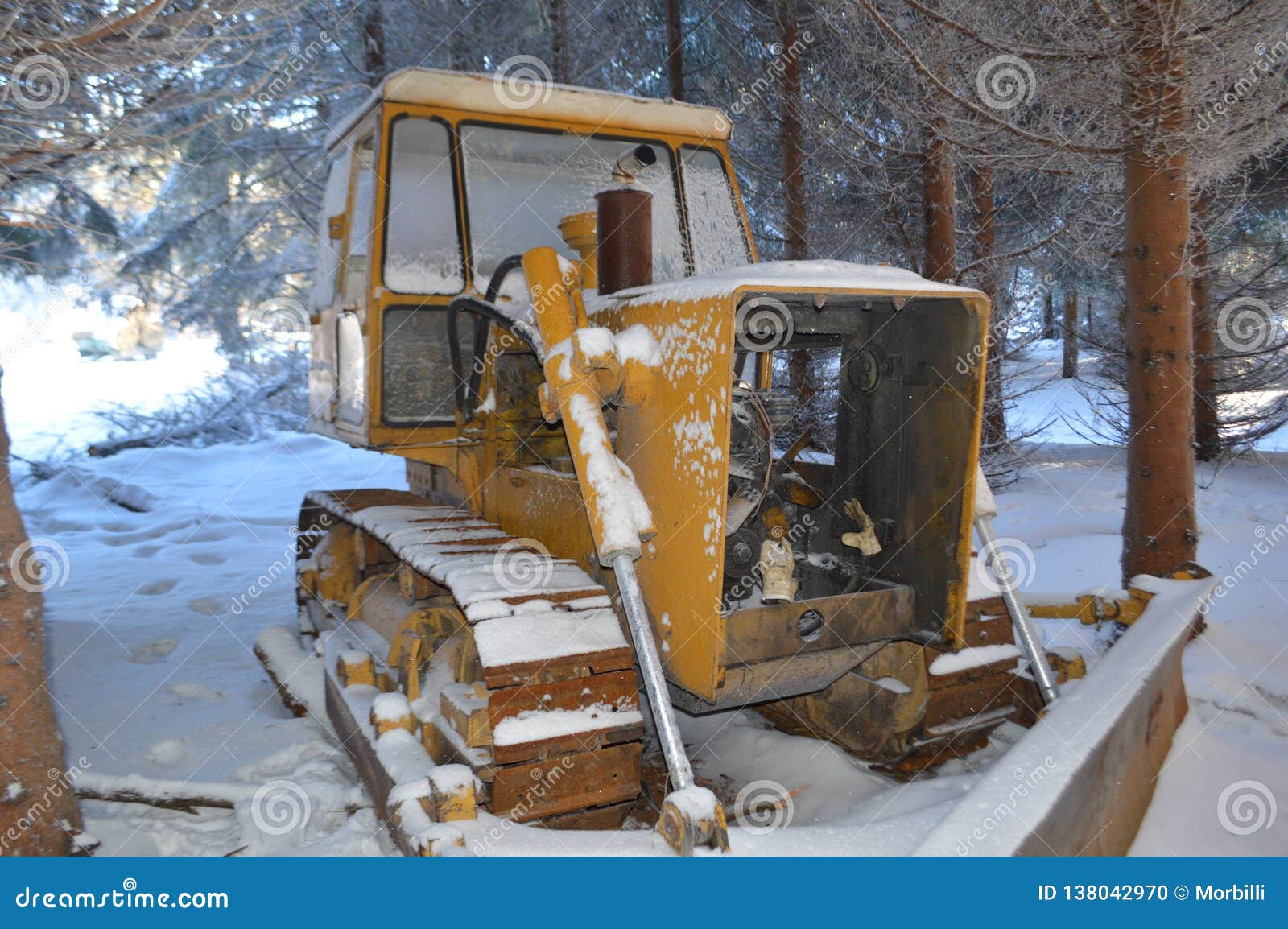 Yellow Bulldozer Covered with Snow Abandoned in Forest Stock Photo ...