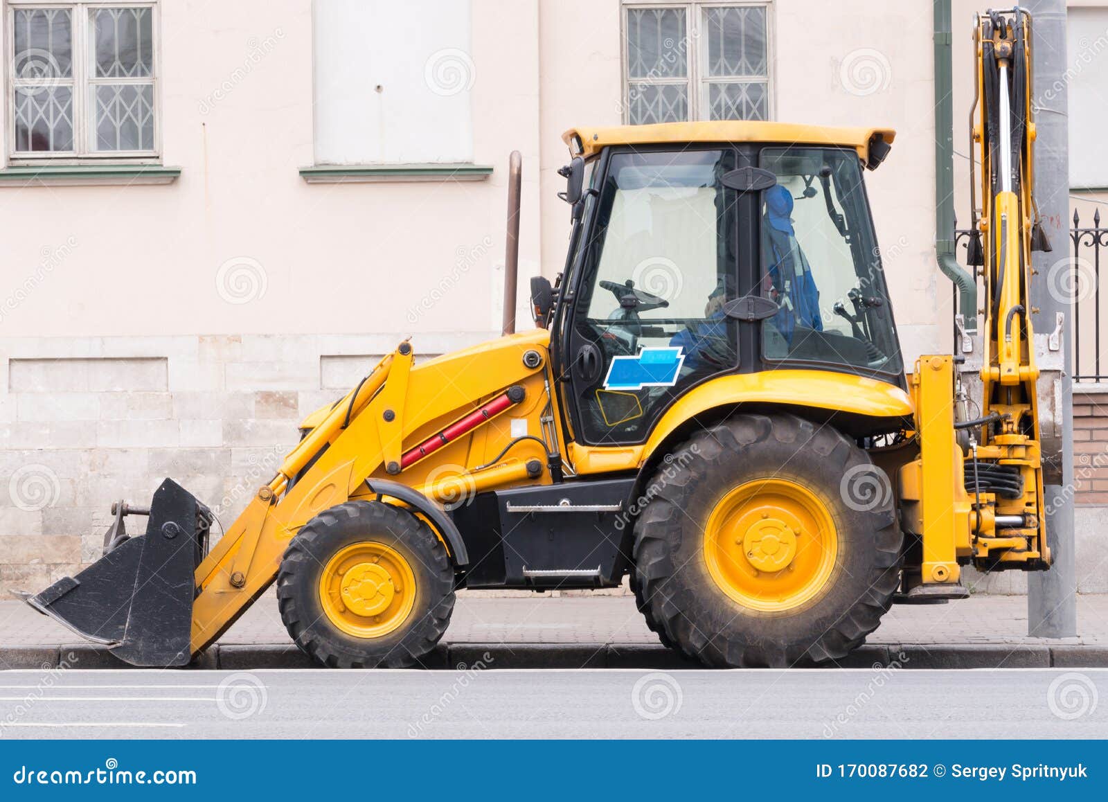 The Yellow Bulldozer Stands at the Old Building Stock Photo - Image of ...