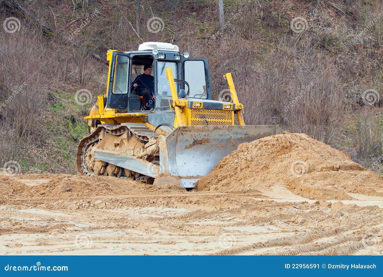 A yellow bulldozer working stock image. Image of loader - 22956591