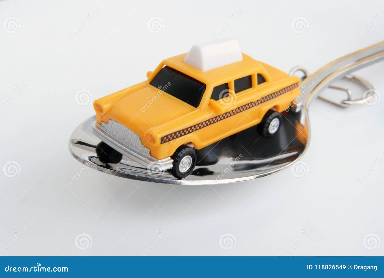 Yellow Cab Model in a Spoon. Yellow Cab Toy Key Chain. Stock Image ...