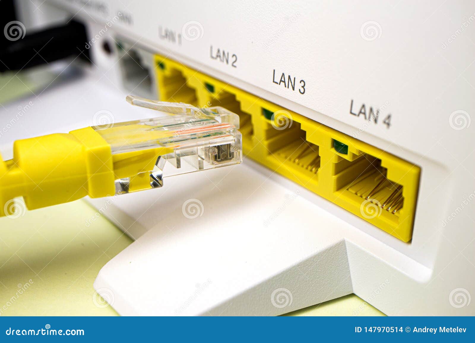 The Yellow Cable with Rj45 Connector is Inserted into the Home Router ...