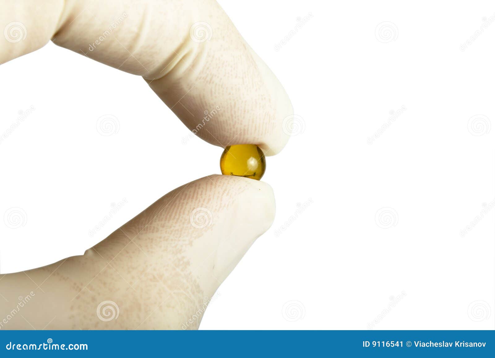 Yellow capsule in fingers stock image. Image of lifestyle - 9116541