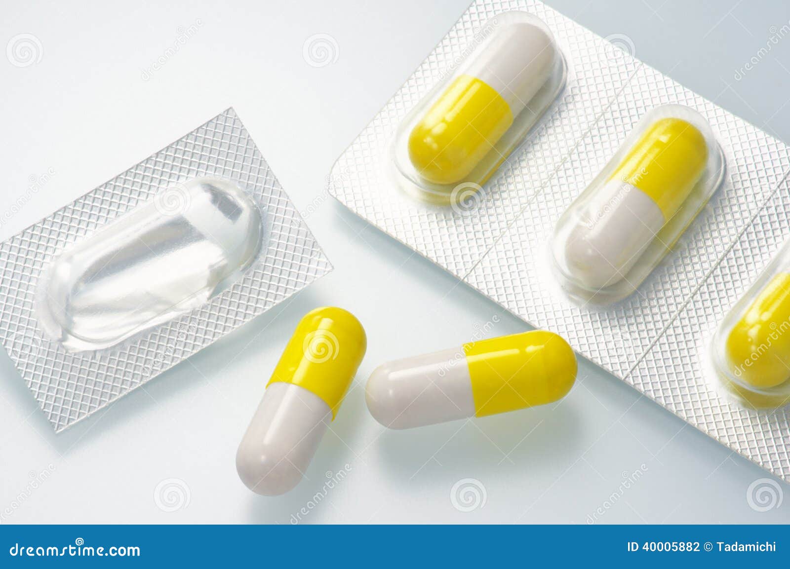 Yellow capsule medicines. stock photo. Image of medicament - 40005882