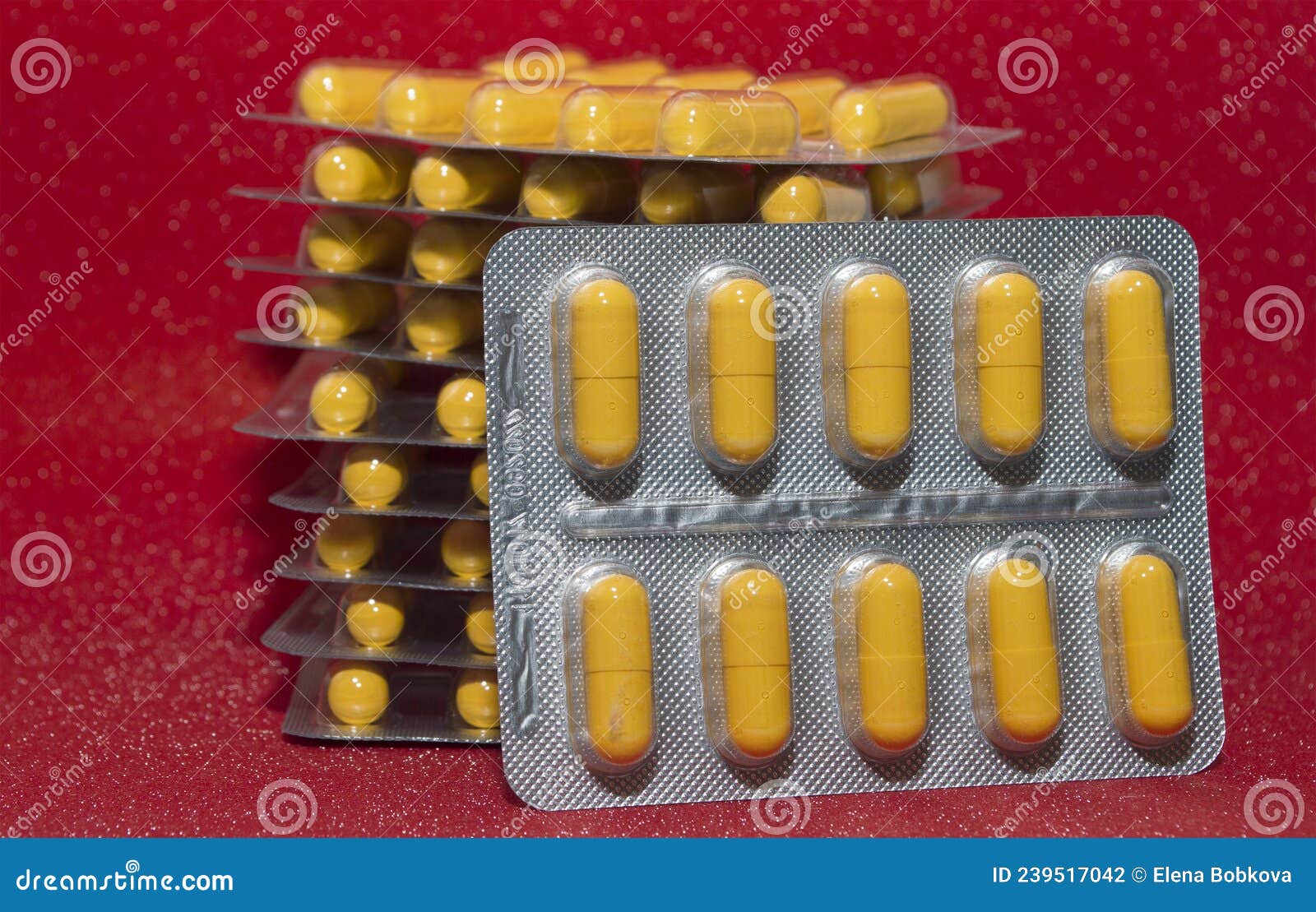 Yellow Capsules Tablets Silver Blister Red Background Stock Photos ...