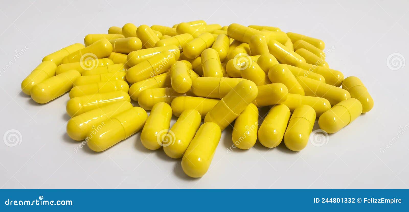 Yellow Capsules on White Background. Selective Focus. Stock Photo ...